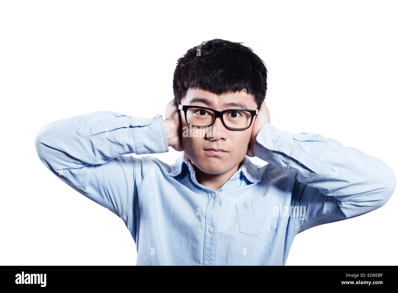 Young man covering ears Stock Photo - Alamy