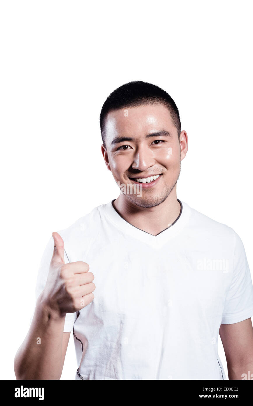 Young man with thumb up Stock Photo - Alamy