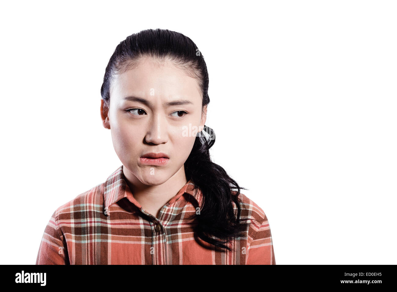 Woman biting lip looking worried hi-res stock photography and images ...