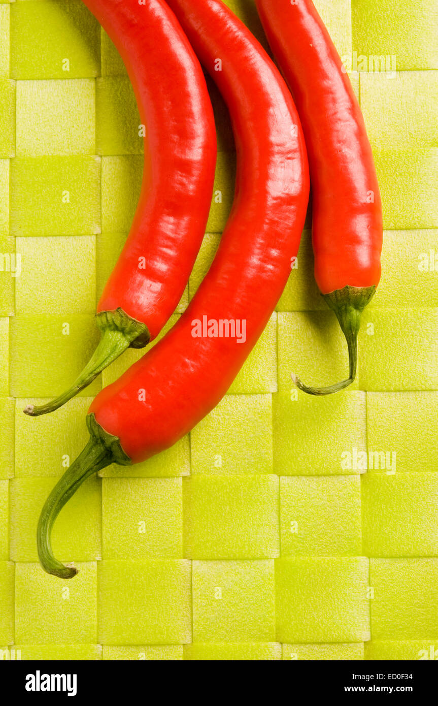 three red chili peppers Stock Photo - Alamy
