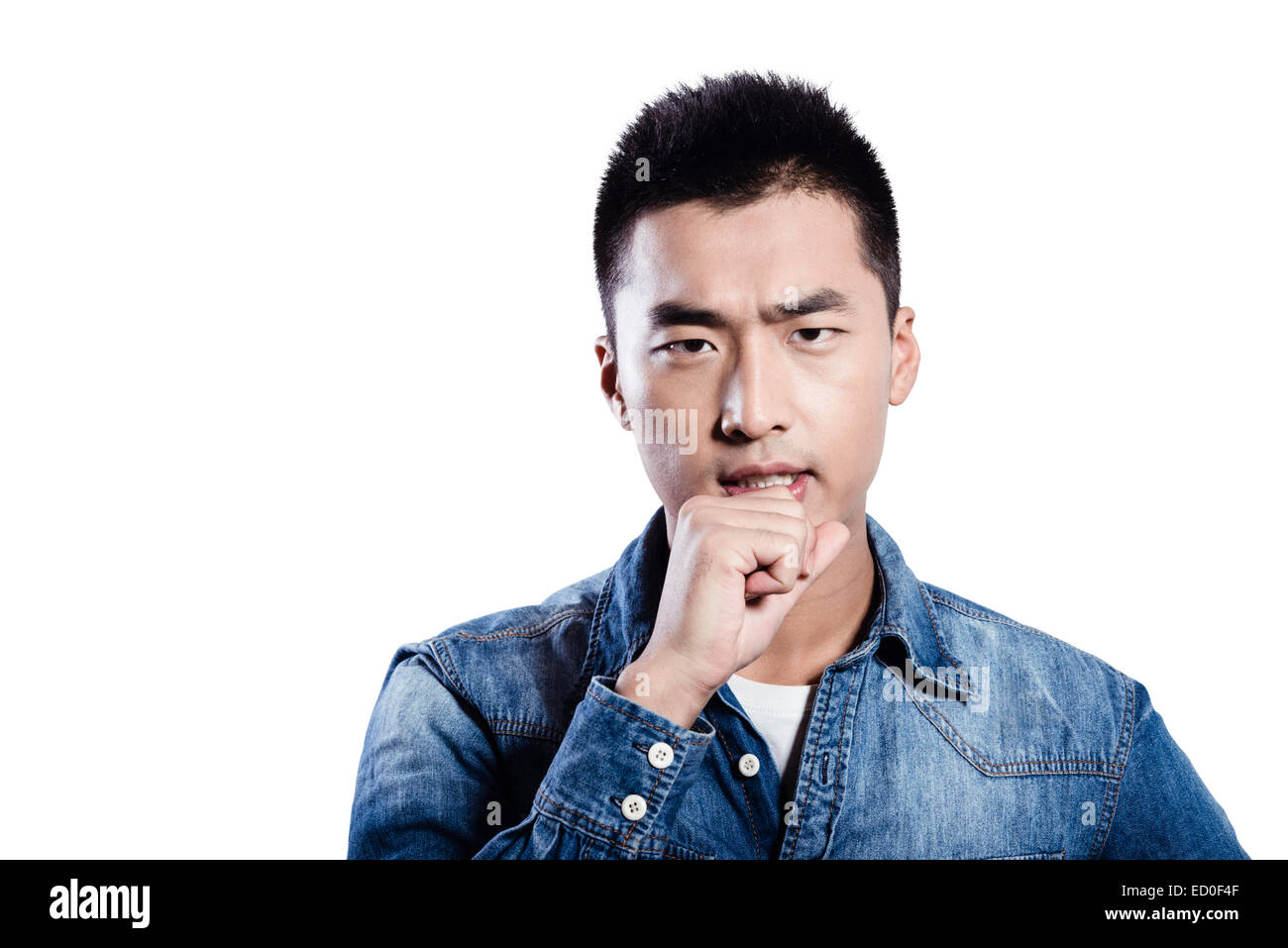 Portrait of suspicious young man Stock Photo - Alamy
