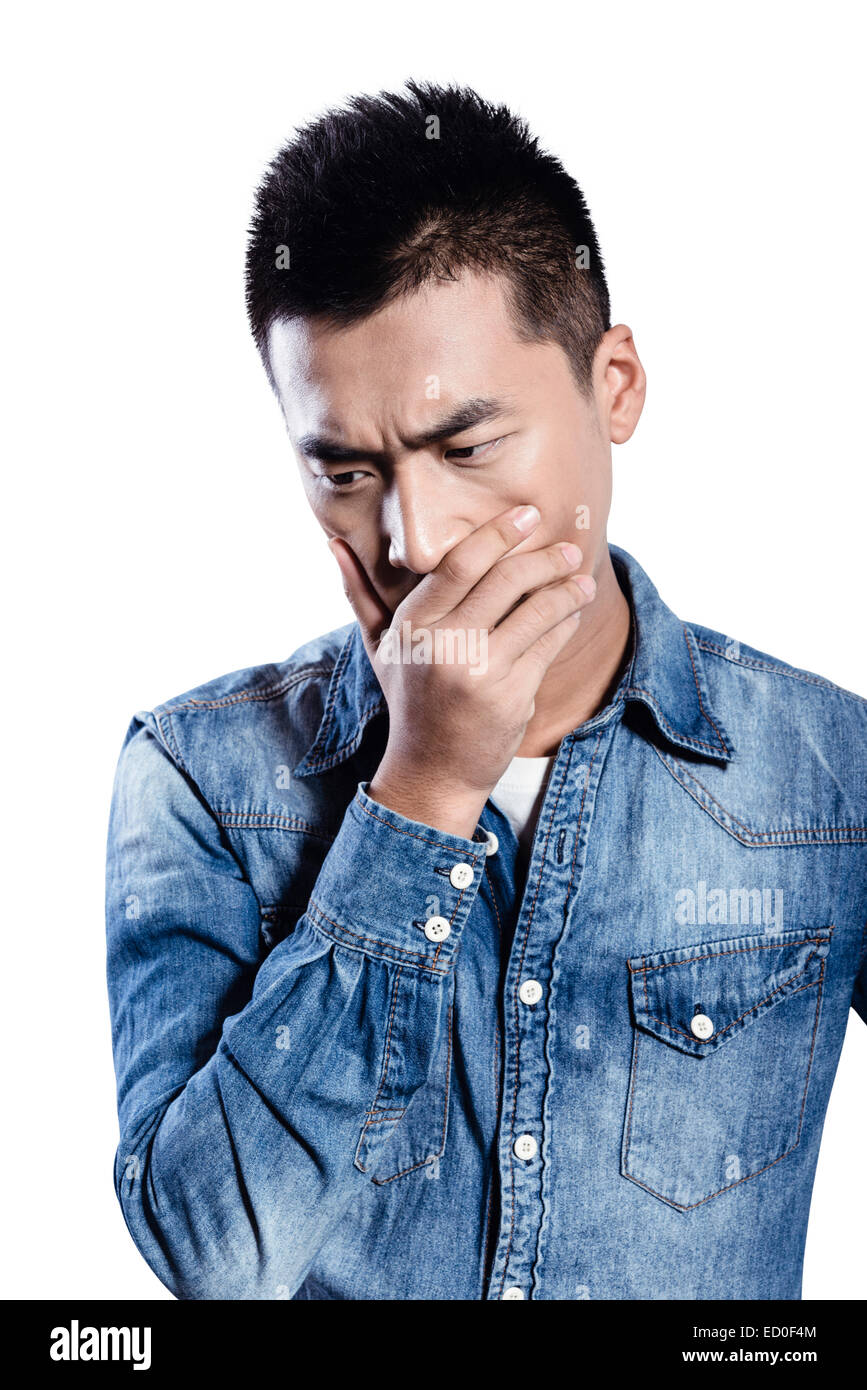 Portrait of suspicious young man Stock Photo - Alamy