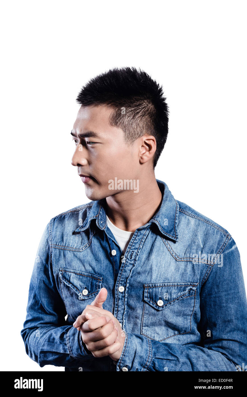 Portrait of suspicious young man Stock Photo - Alamy