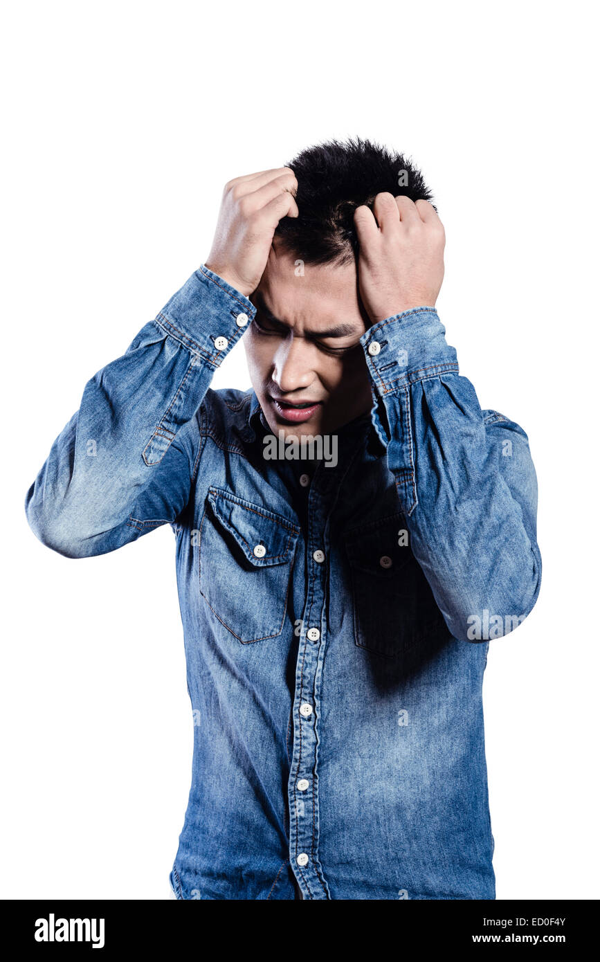 Portrait of suspicious young man Stock Photo - Alamy