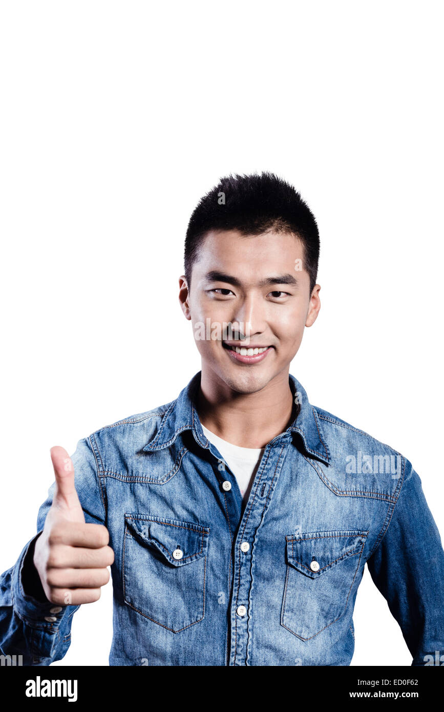 Portrait of young man with thumb up Stock Photo - Alamy