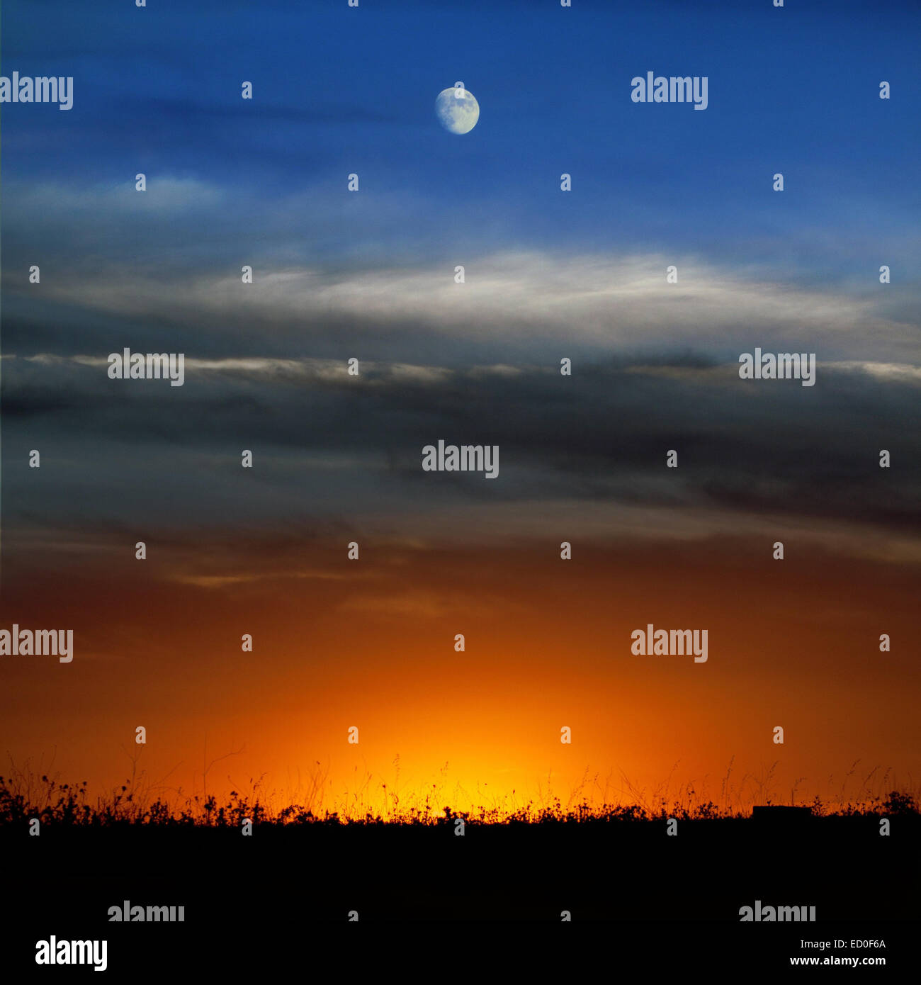 Spain, Moon over sunset Stock Photo - Alamy