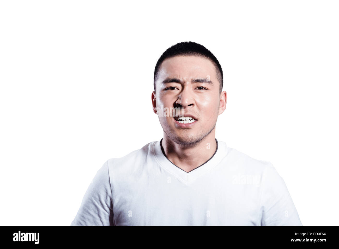 Portrait of angry young man Stock Photo - Alamy