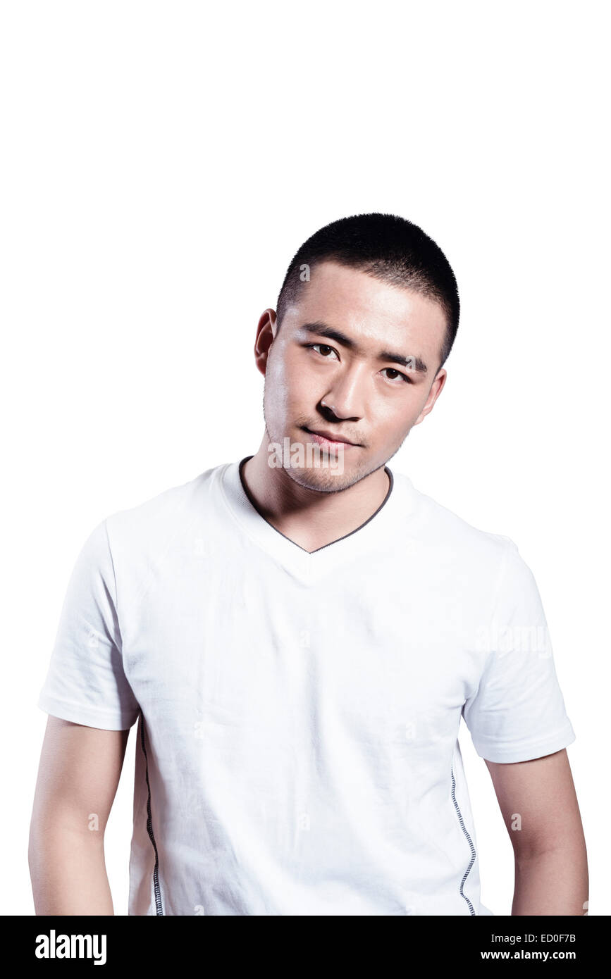 Portrait of suspicious young man Stock Photo - Alamy