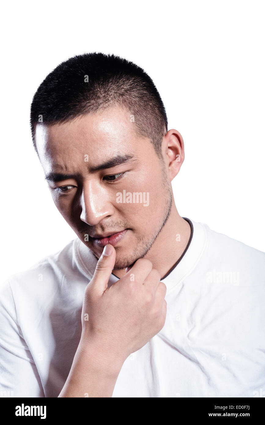 Portrait of young man contemplating Stock Photo - Alamy