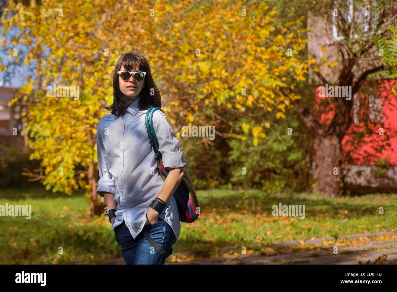 Portrait of young woman in autumn scenery Stock Photo - Alamy