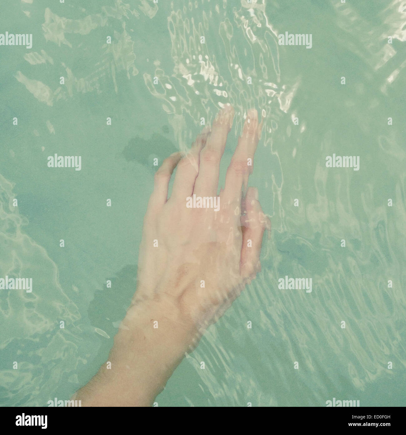 Hand under water Stock Photo - Alamy