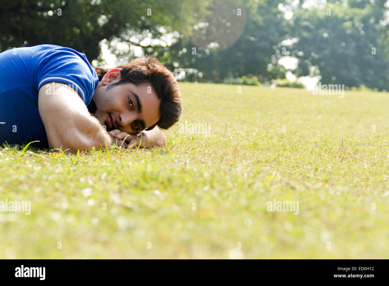 Indian man face looking down hi-res stock photography and images - Alamy