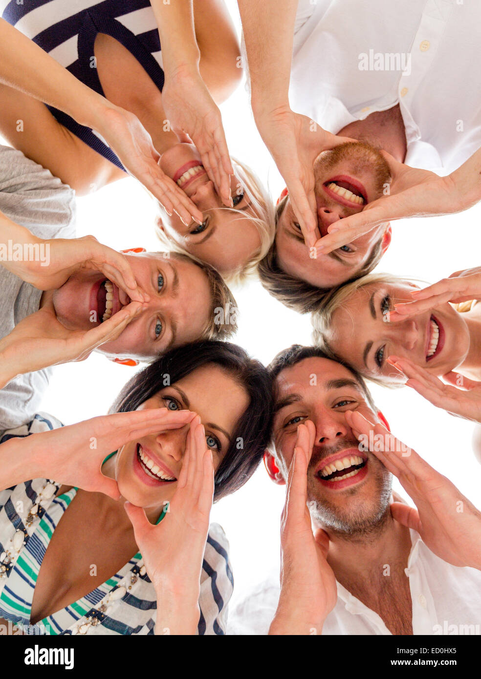 smiling friends in circle Stock Photo - Alamy