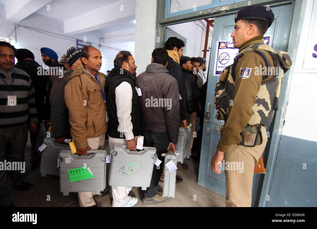 Jammu, Indian-controlled Kashmir. 23rd Dec, 2014. Polling officials ...