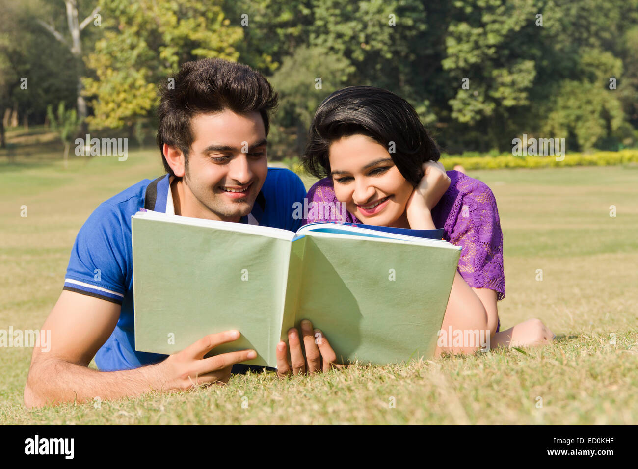 2 indian College couple park book study Stock Photo - Alamy