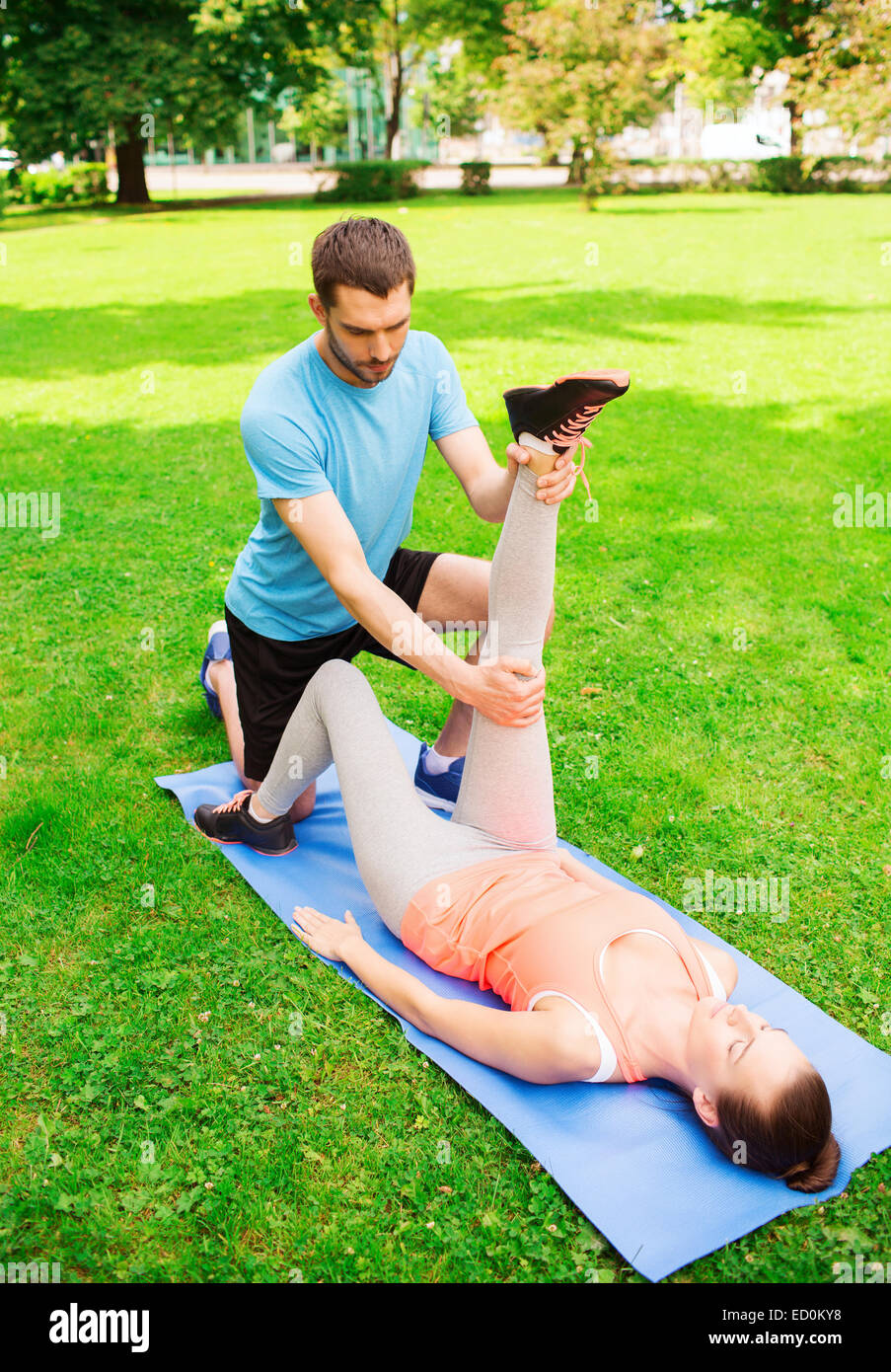 serious couple stretching outdoors Stock Photo - Alamy
