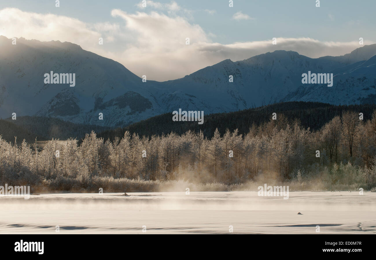 The Chilkat Valley under a covering of snow, with mountains behind ...
