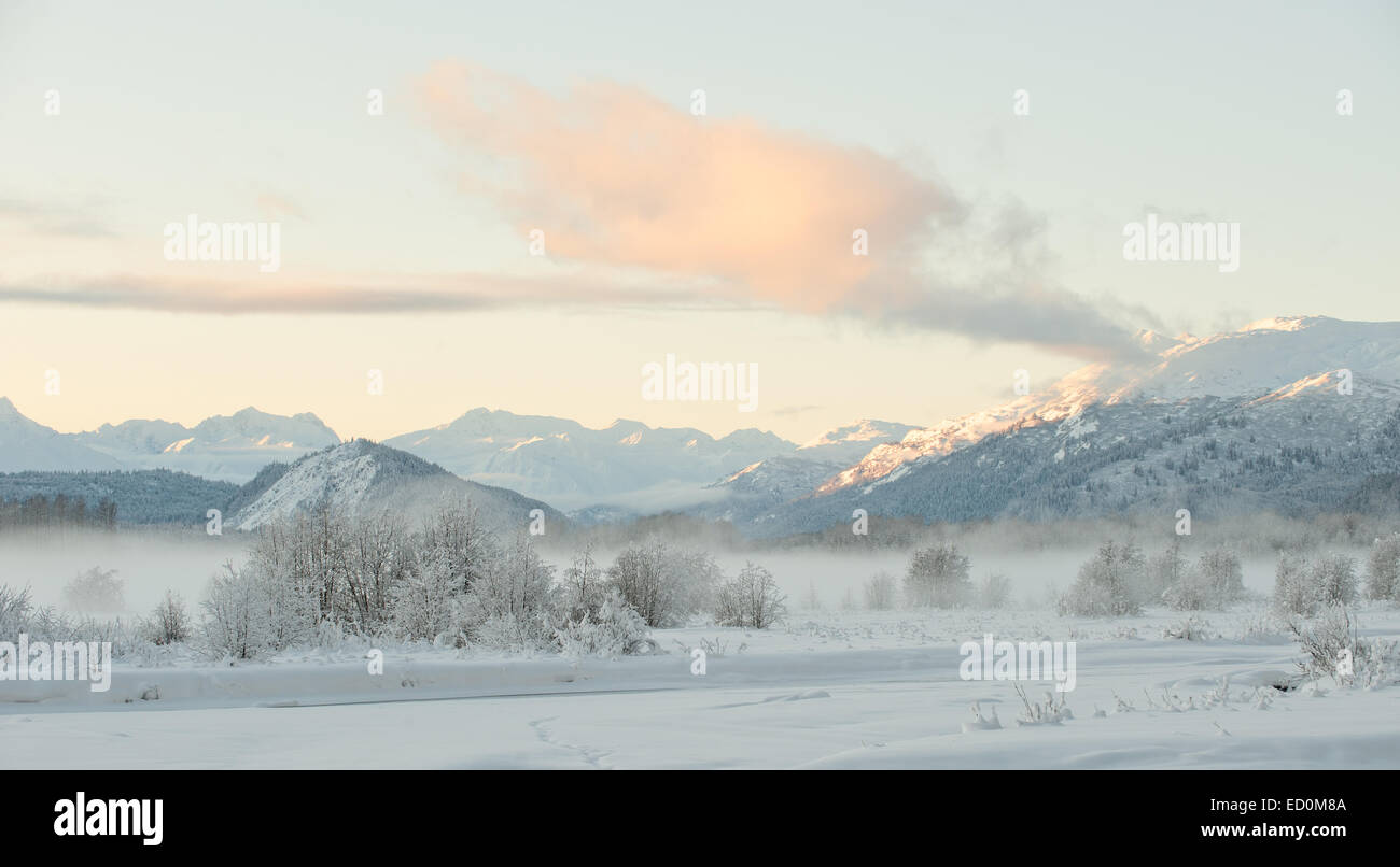 The Chilkat Valley under a covering of snow, with mountains behind ...