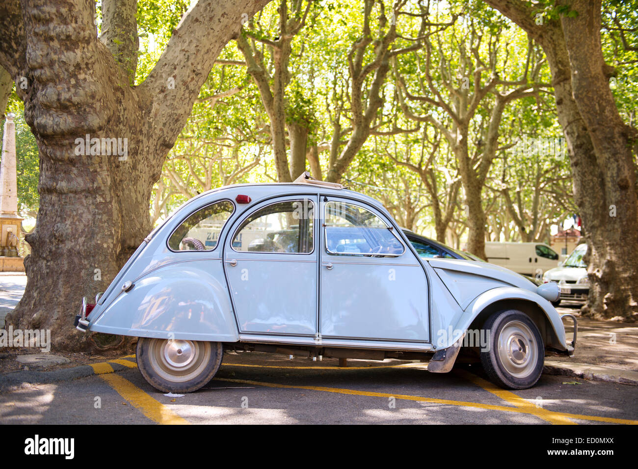 Romantic square with typical lavender blue French car Stock Photo - Alamy