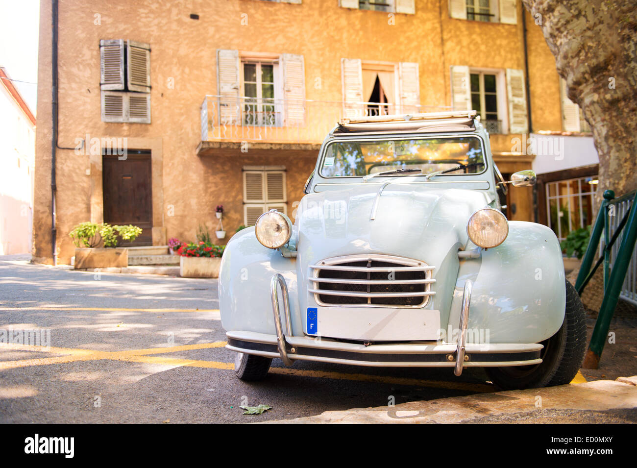 Romantic square with typical lavender blue French car Stock Photo - Alamy