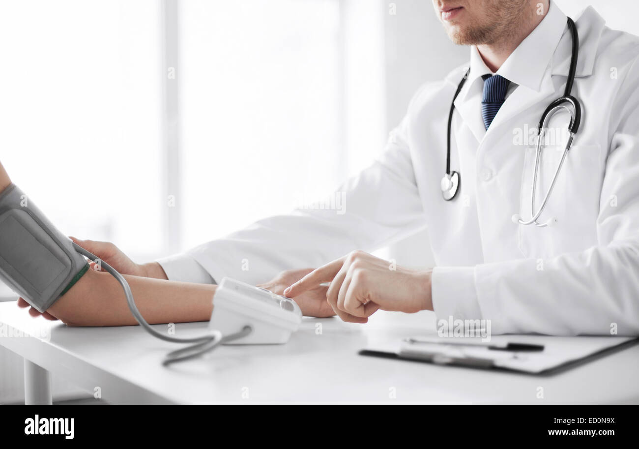 doctor and patient measuring blood pressure Stock Photo - Alamy