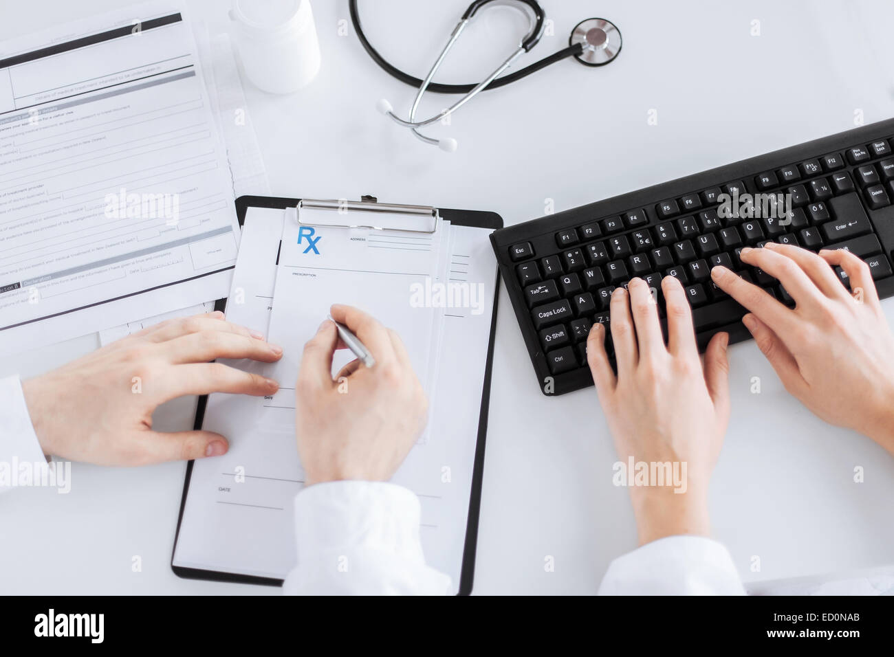 doctor and nurse writing prescription paper Stock Photo - Alamy