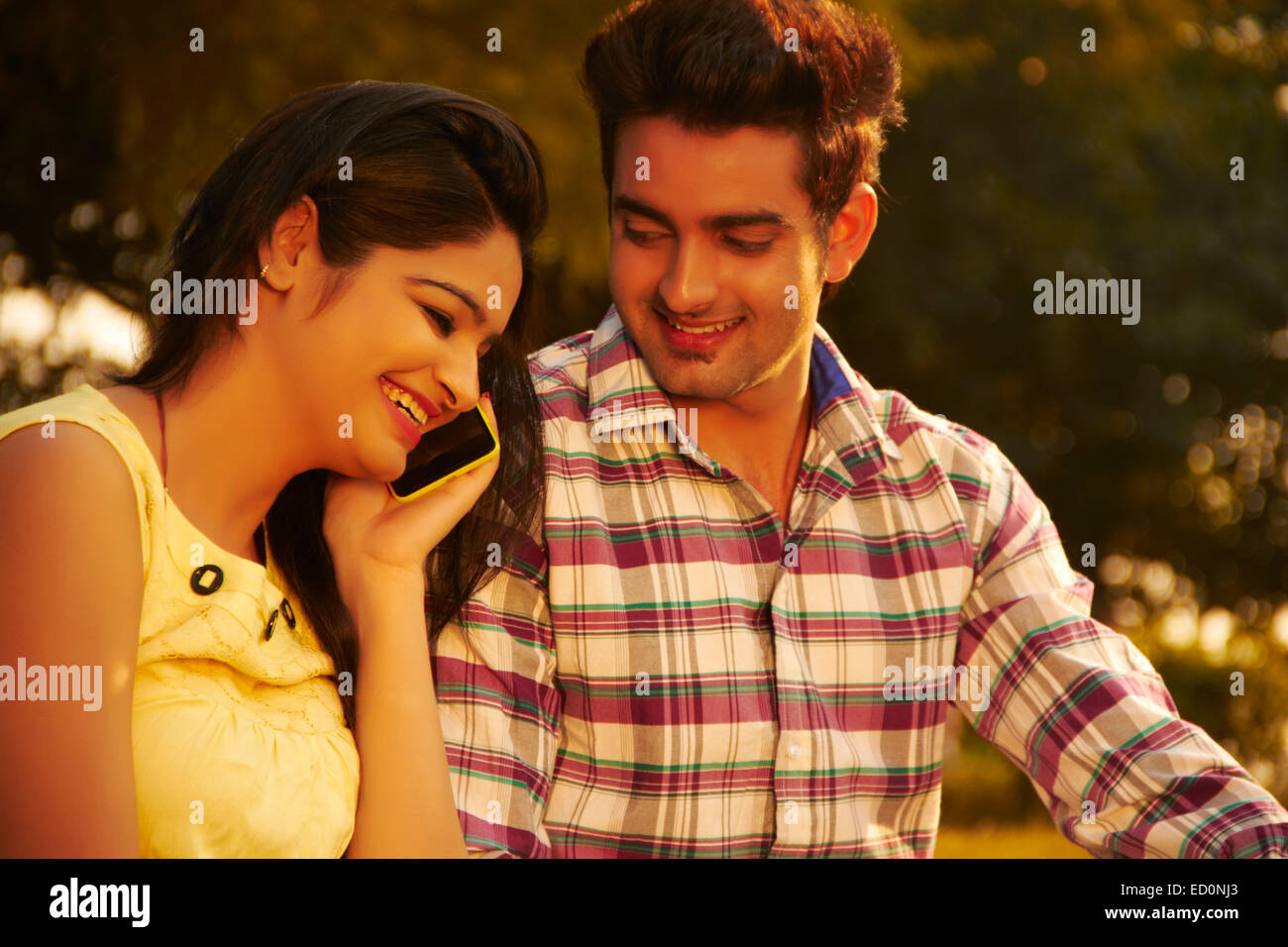 Indian beautiful couple talking phone hi-res stock photography and ...