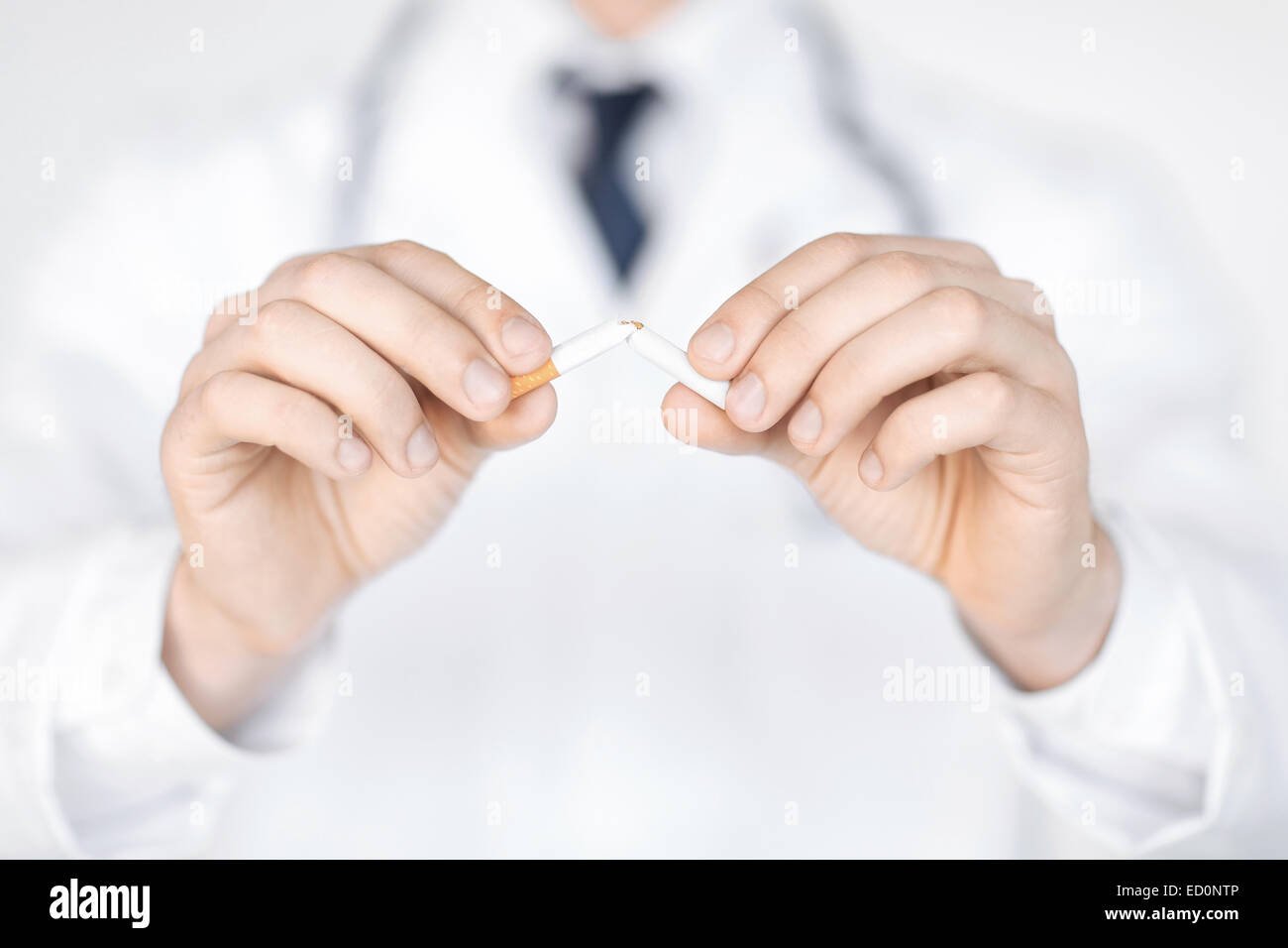 man breaking the cigarette with hands Stock Photo - Alamy