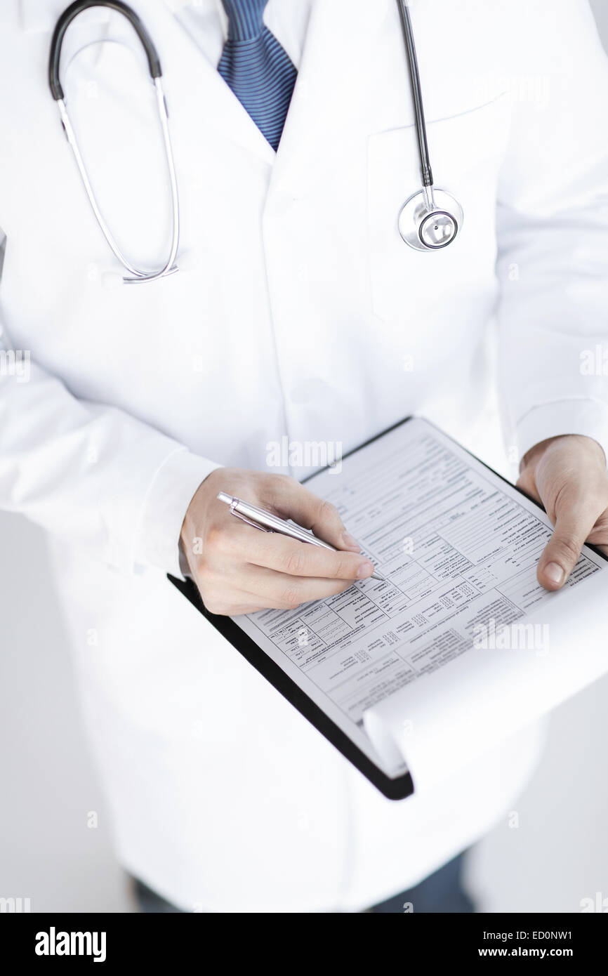 male doctor holding prescription paper in hand Stock Photo - Alamy