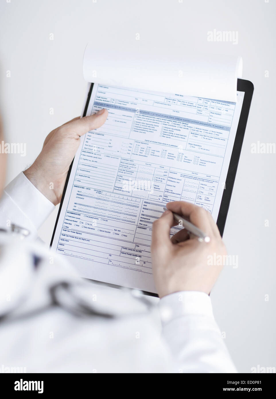 male doctor holding prescription paper in hand Stock Photo - Alamy