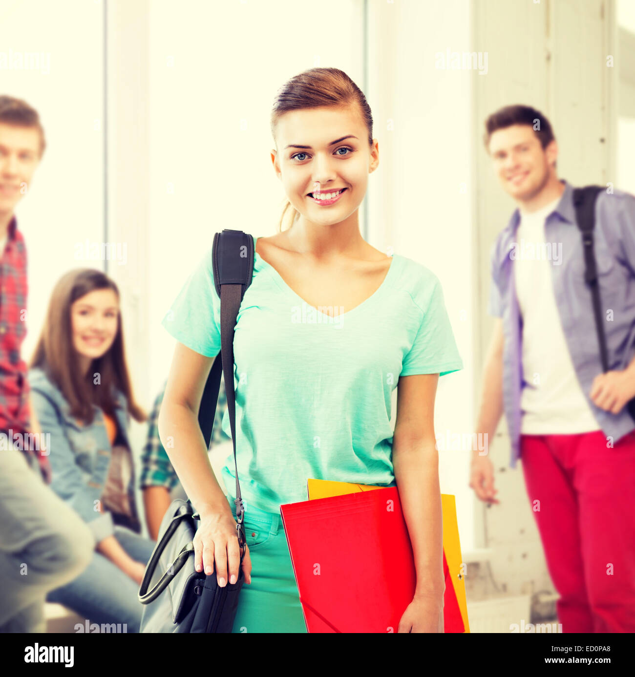 student girl with school bag and color folders Stock Photo - Alamy