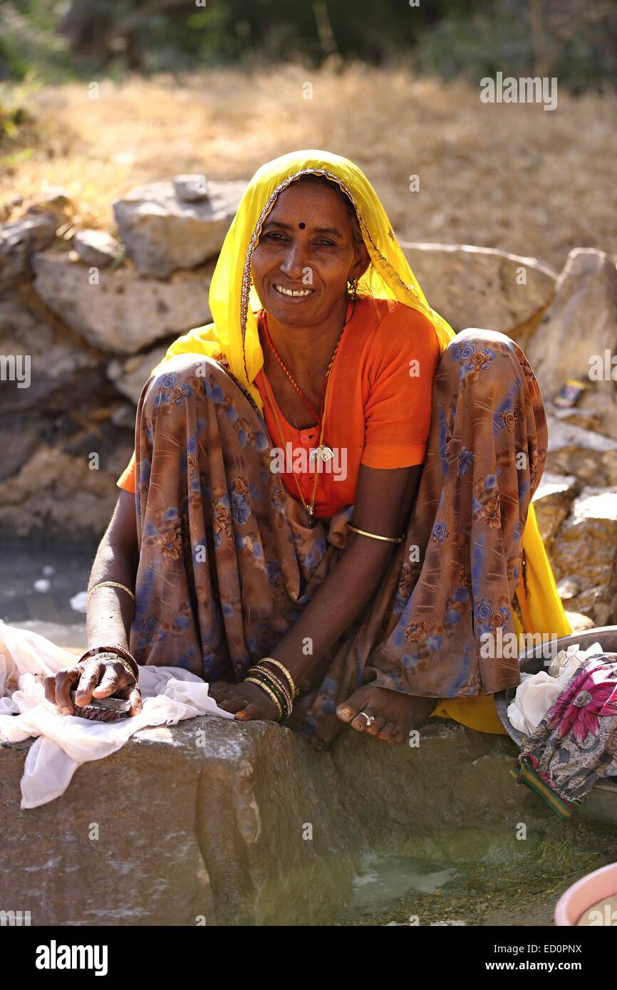 Indian woman washing clothes hi-res stock photography and images - Alamy