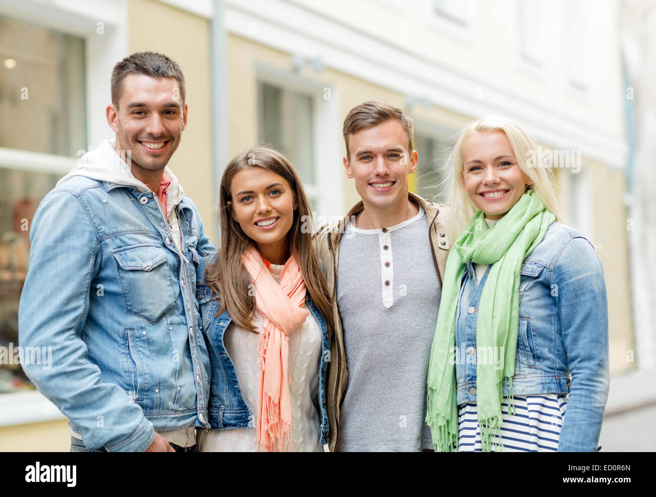 group of smiling friends in city Stock Photo - Alamy