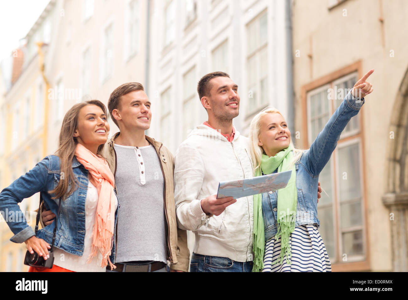 group of smiling friends with map and photocamera Stock Photo - Alamy