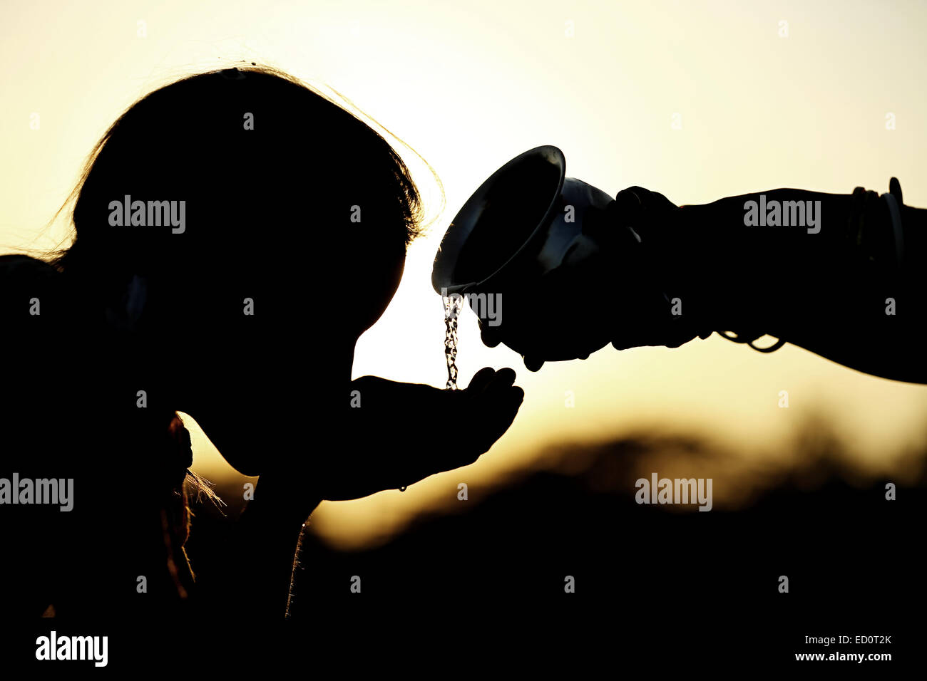 Giving water to the thirsty hi-res stock photography and images - Alamy