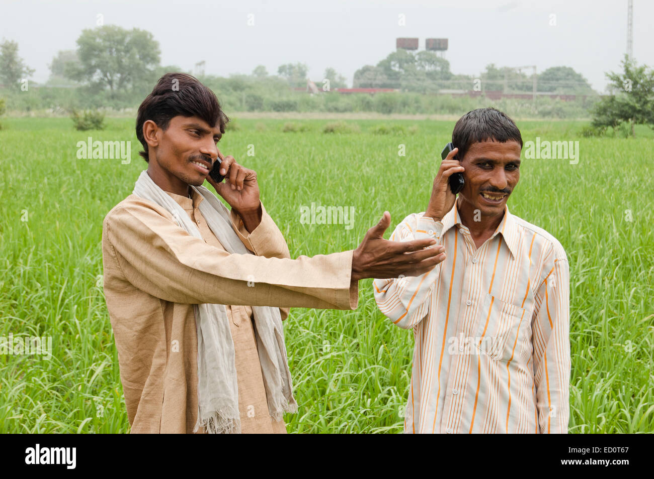 2 indian rural farmer man Field talking phone Stock Photo - Alamy