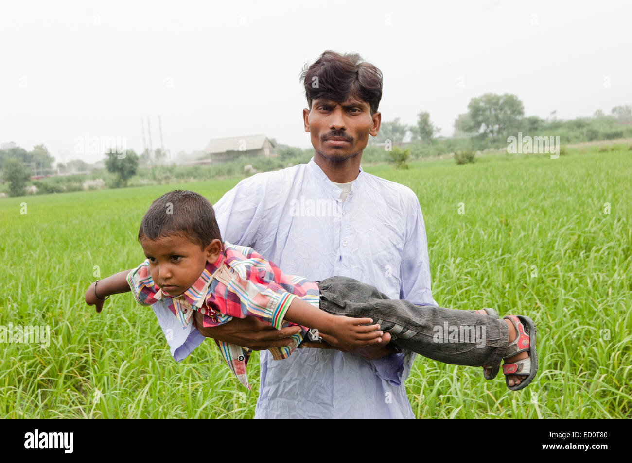 indian rural father with child field fun Stock Photo - Alamy