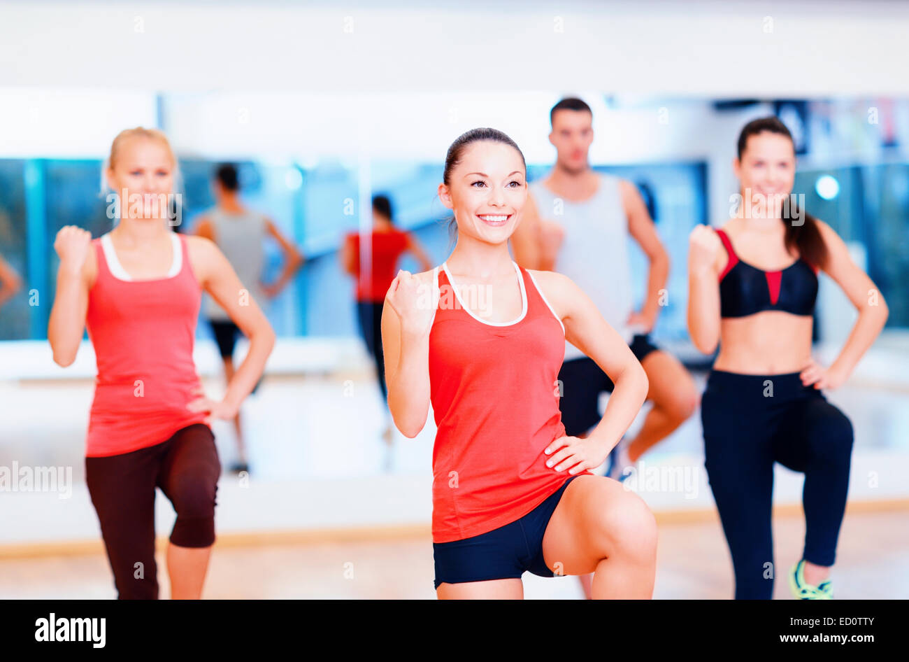 group of smiling people exercising in the gym Stock Photo - Alamy