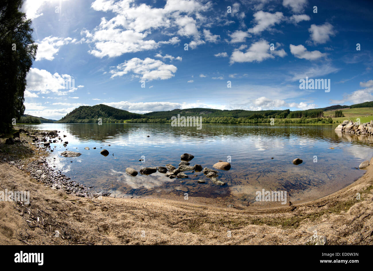 A small sandy beach on the shores of the RSPBs Loch Ruthven reserve in ...
