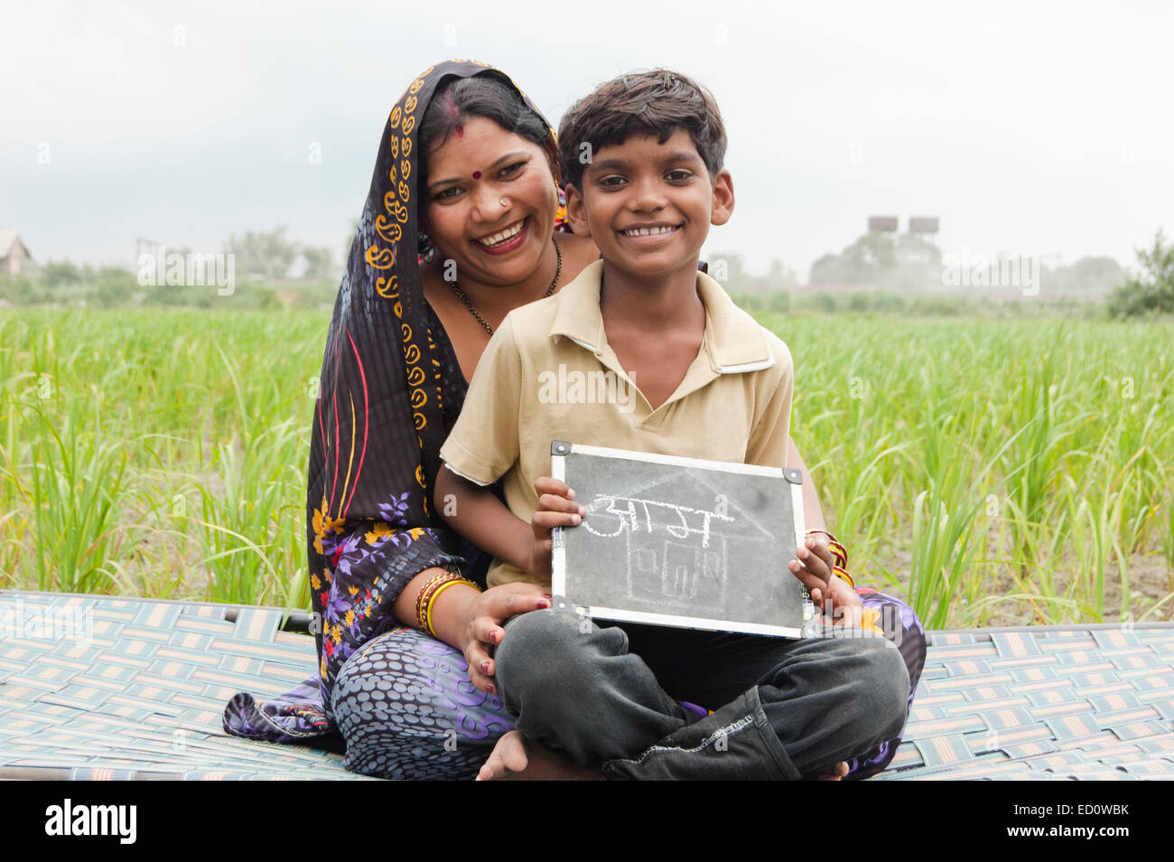 indian rural mother with child study Stock Photo - Alamy