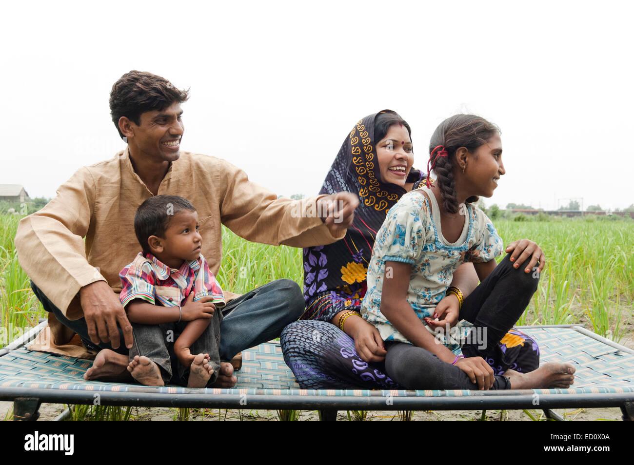 Indian rural parents child field hi-res stock photography and images ...