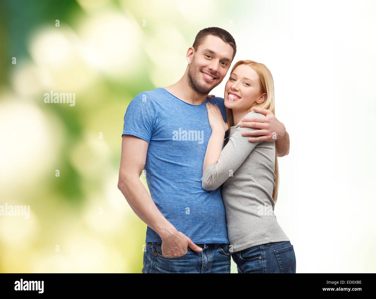 smiling couple hugging Stock Photo - Alamy