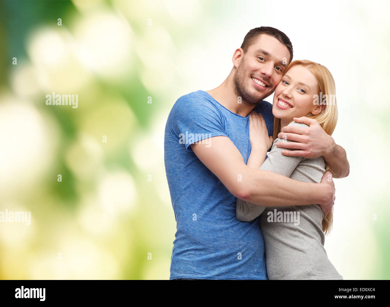 smiling couple hugging Stock Photo - Alamy