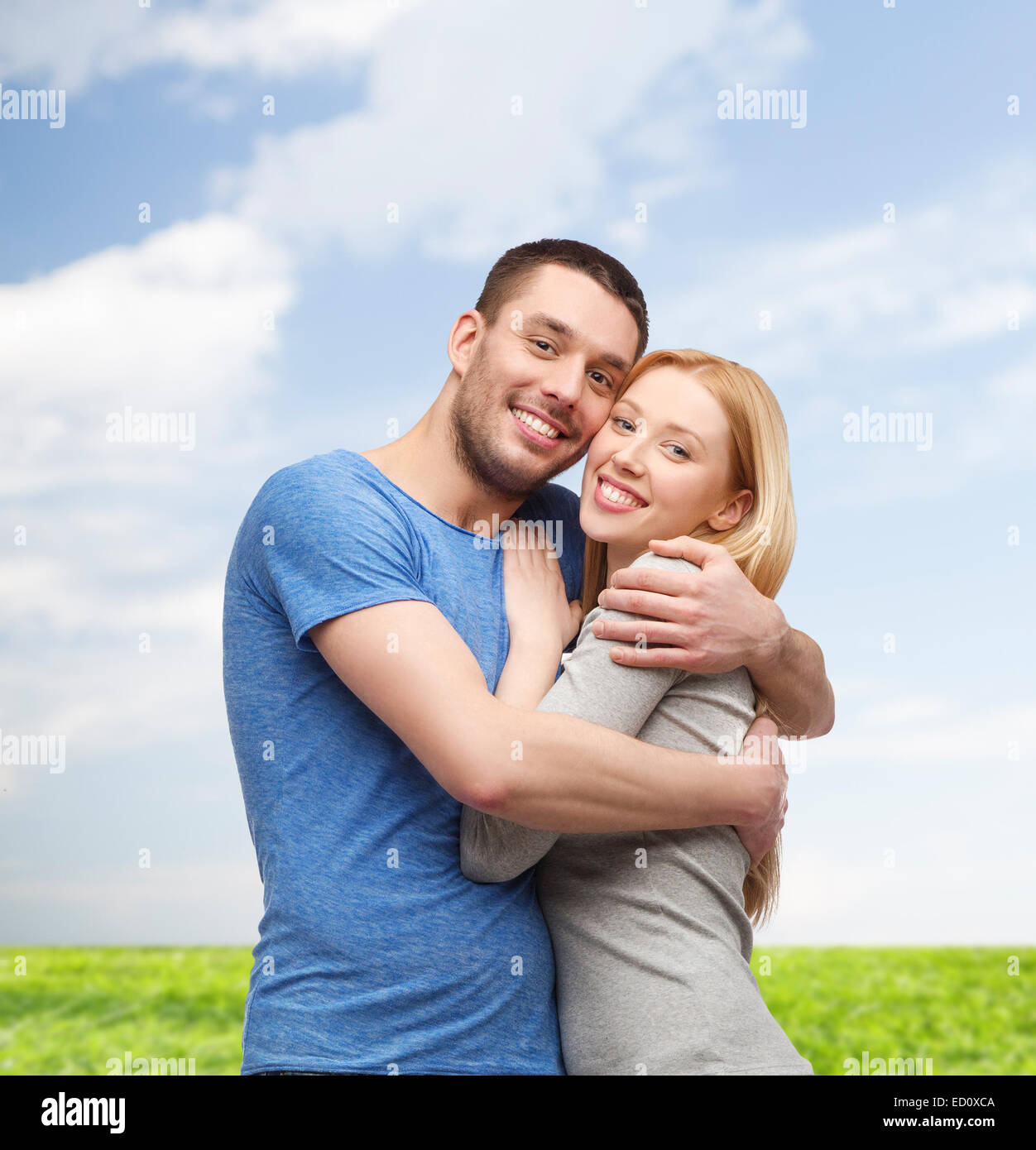 smiling couple hugging Stock Photo - Alamy