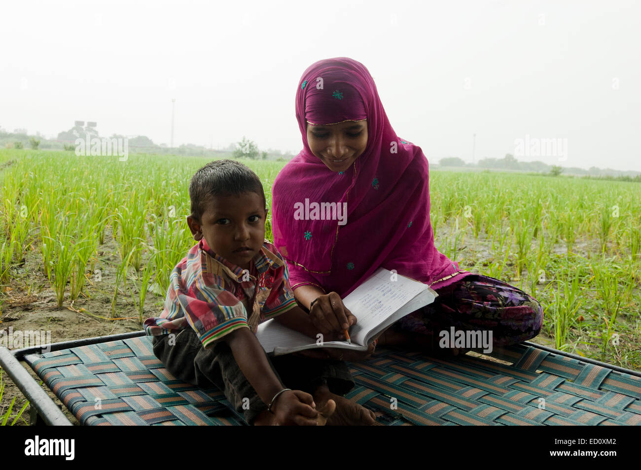 indian rural girl Teaching child Stock Photo - Alamy