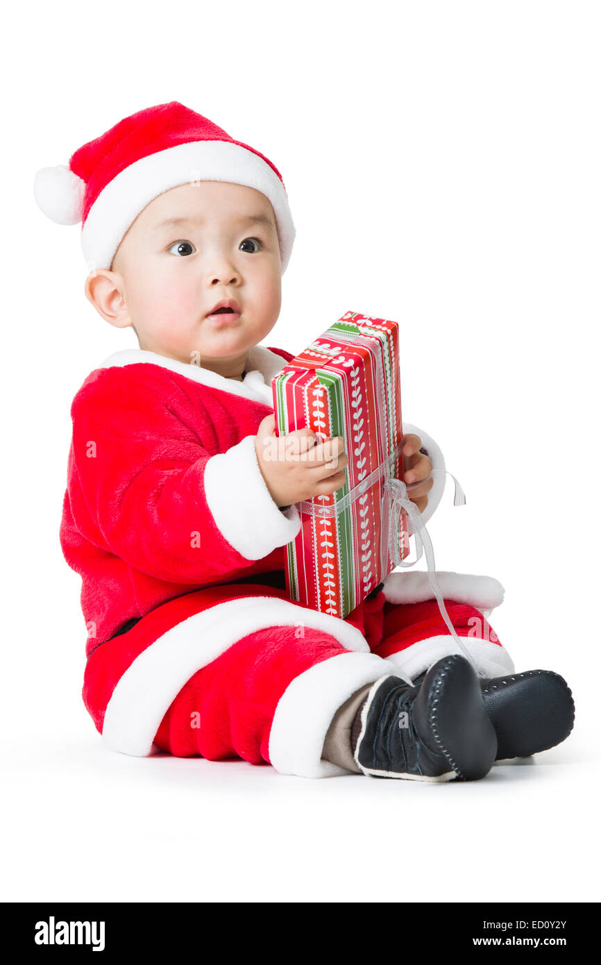 Santa baby holding Christmas gift Stock Photo - Alamy