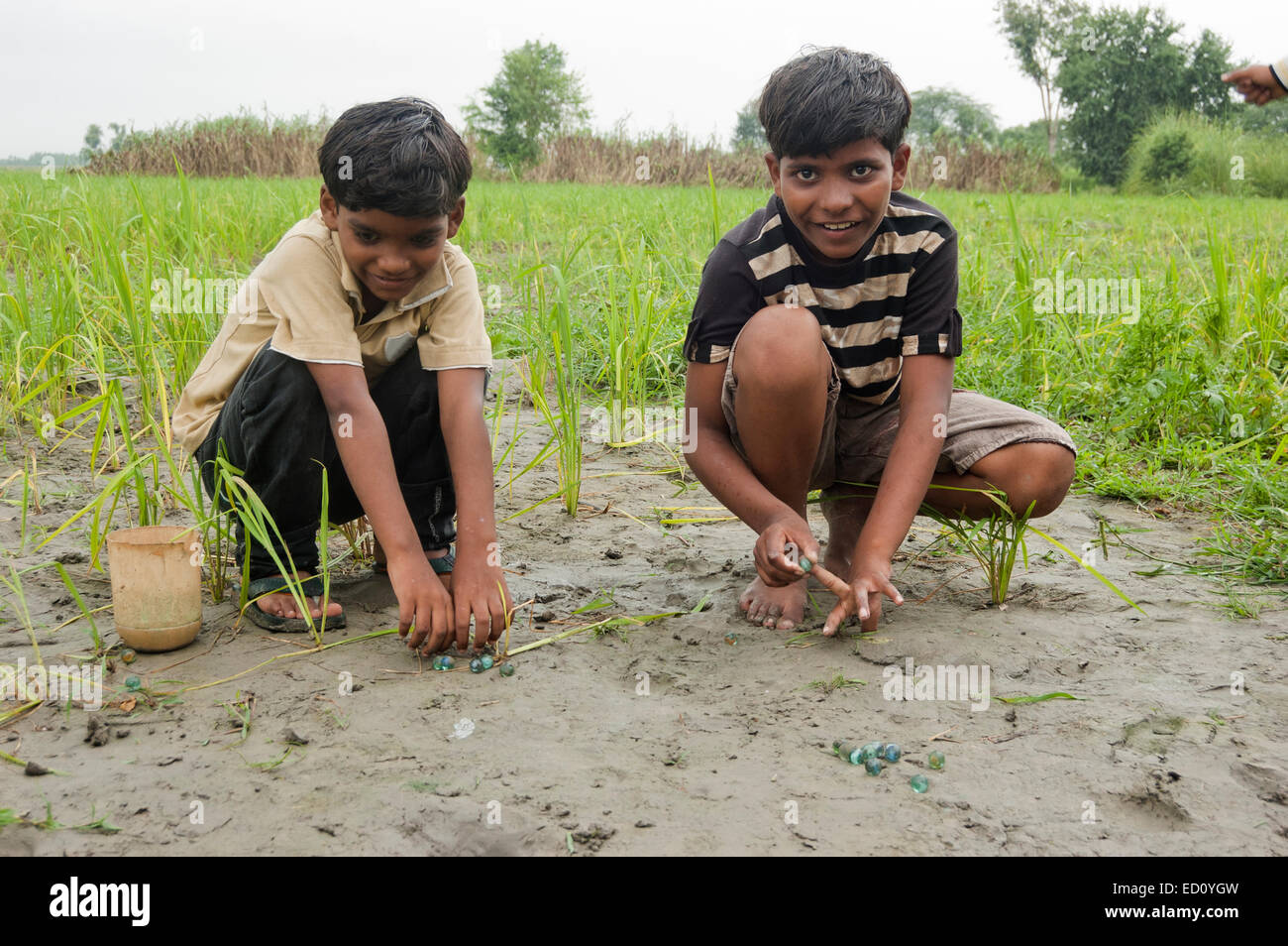 2 indian rural child farm playing Stock Photo - Alamy