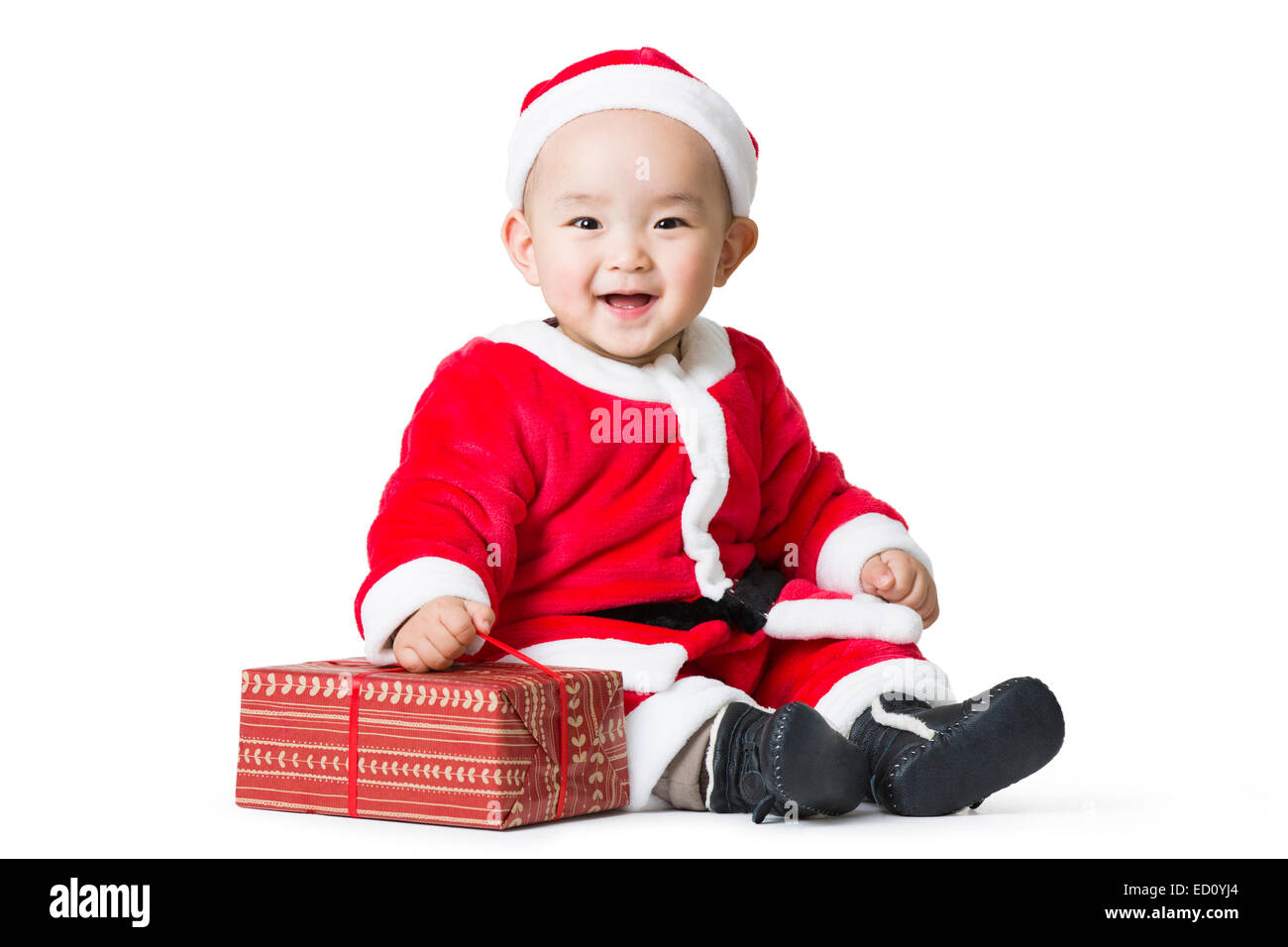 Santa baby holding Christmas gift Stock Photo - Alamy