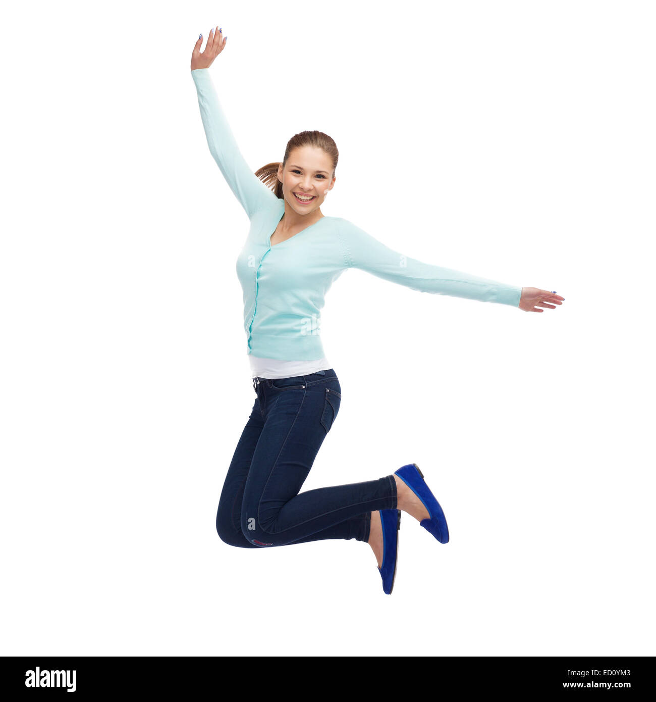 smiling young woman jumping in air Stock Photo - Alamy