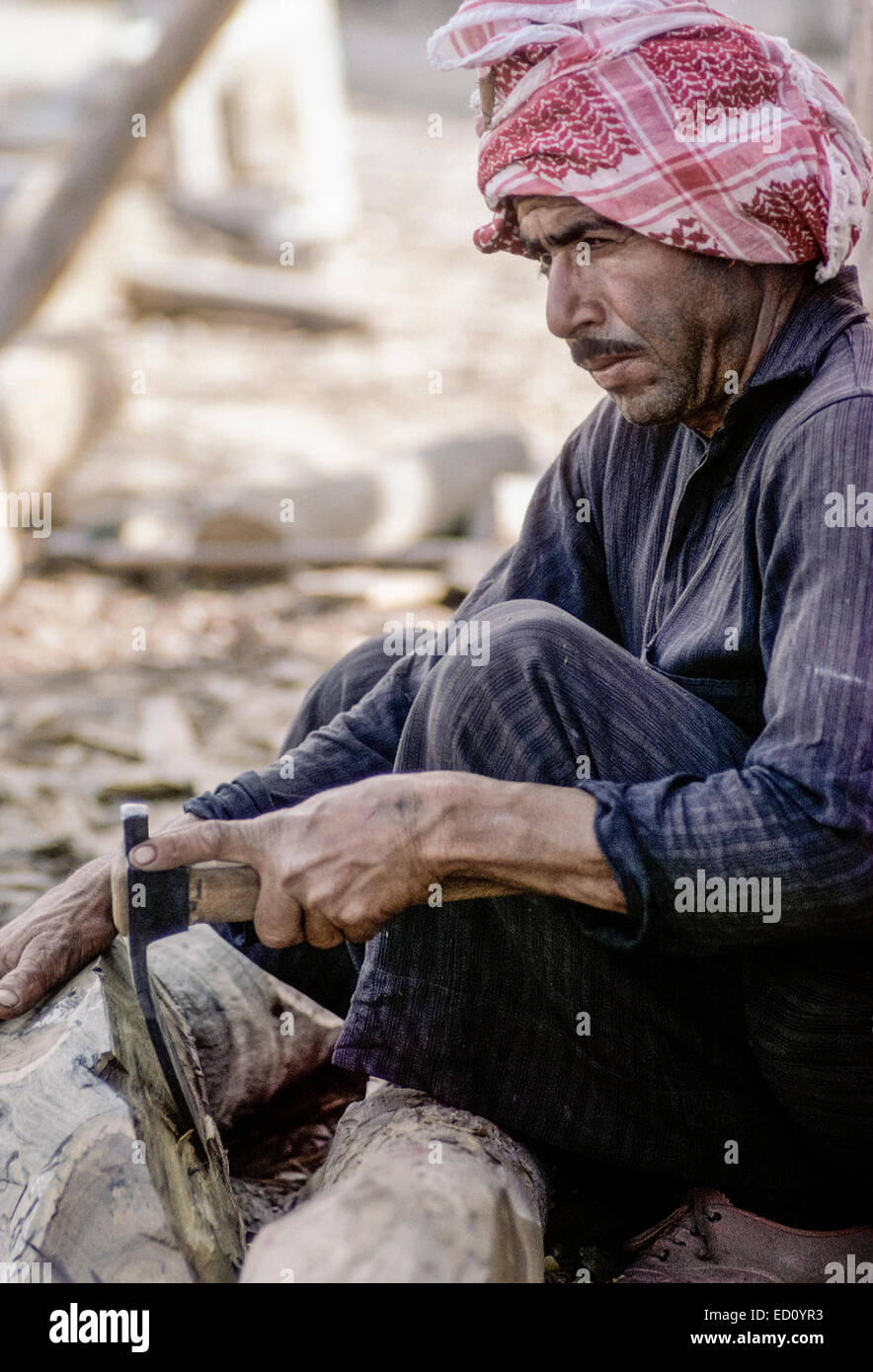 Kuwait April 1967. Carpenter Using an Adze to Shape a Log to Serve as ...